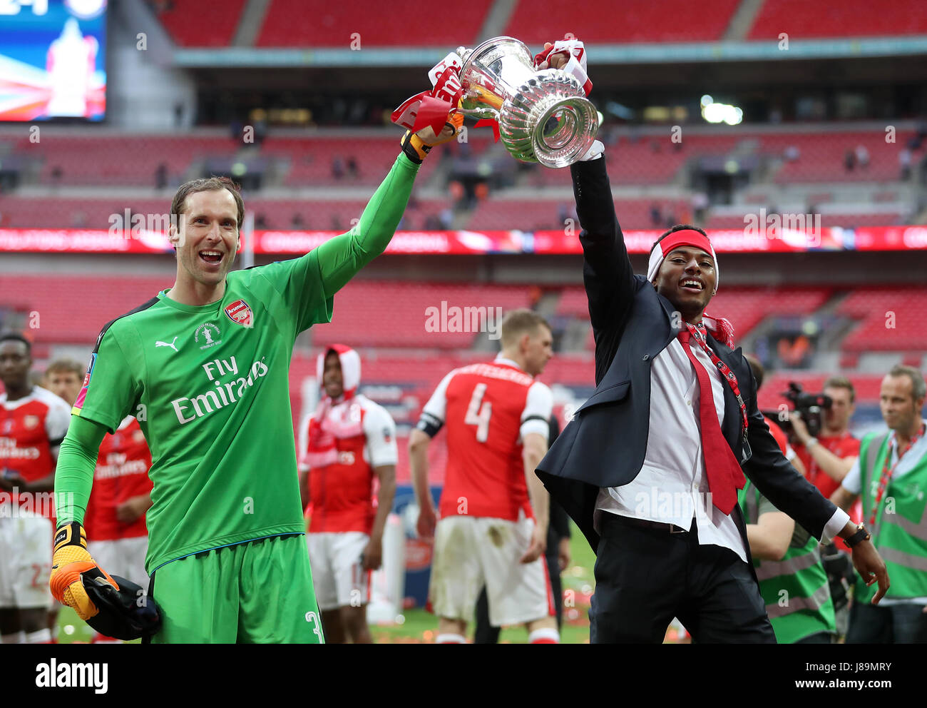 Arsenal goalkeeper Petr Cech and Jeff Reine-Adelaide celebrate with the ...