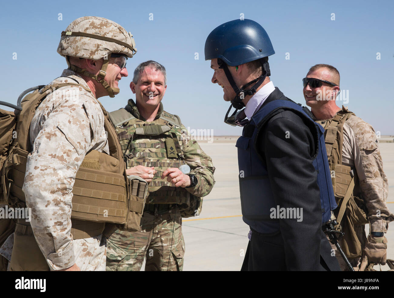 The Honorable Dominic Jermey, right, the British Ambassador to ...