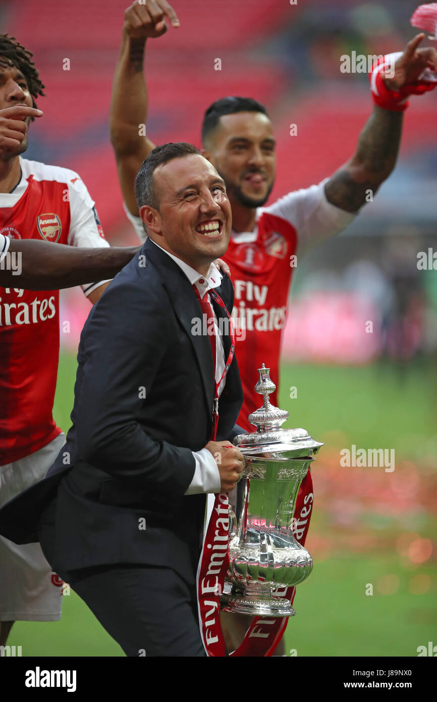 Arsenal's Santi Cazorla celebrates with the FA Cup trophy after the ...
