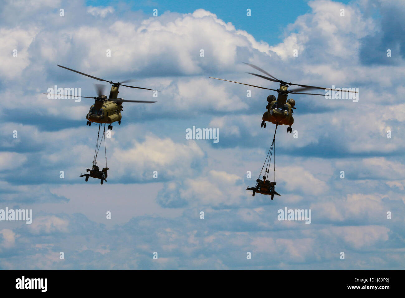 Two Boeing CH-47 Chinook helicopter's fly over Sicily Drop Zone with ...