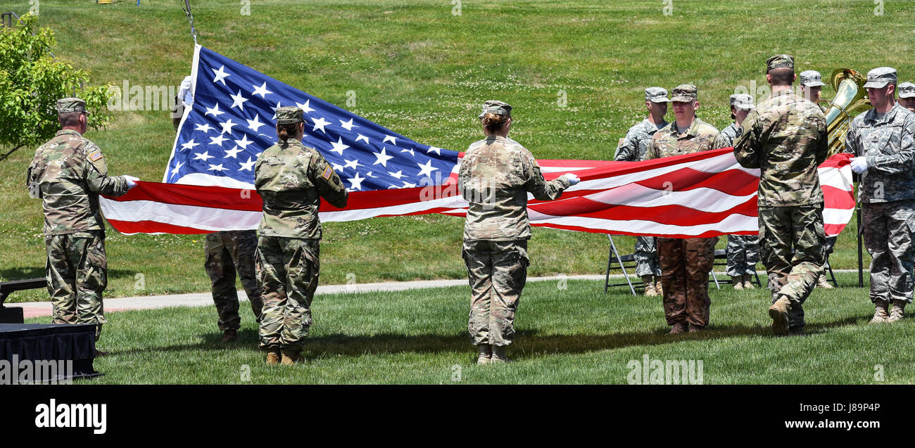 Members of the Iowa National Guard fold the U.S. flag while conducting ...