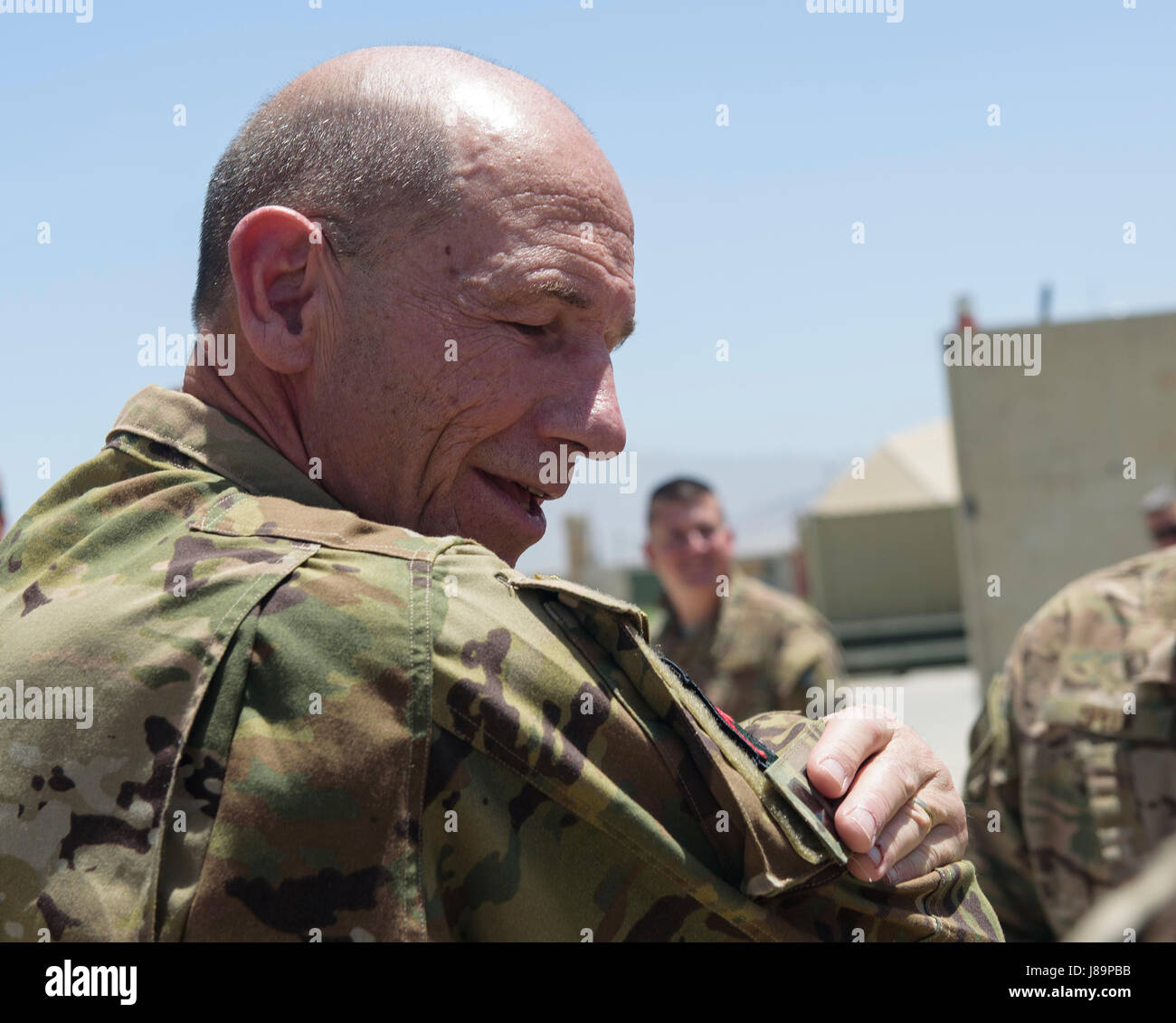 Gen. Mike Holmes, commander of Air Combat Command, places a patch on ...