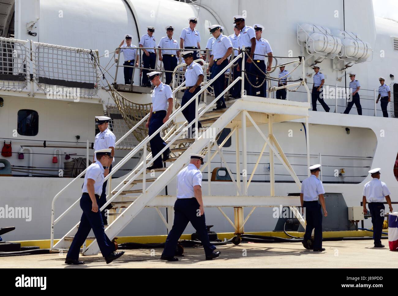 Crewmembers disembark Hamilton-class cutter (WHEC-722) during a ...