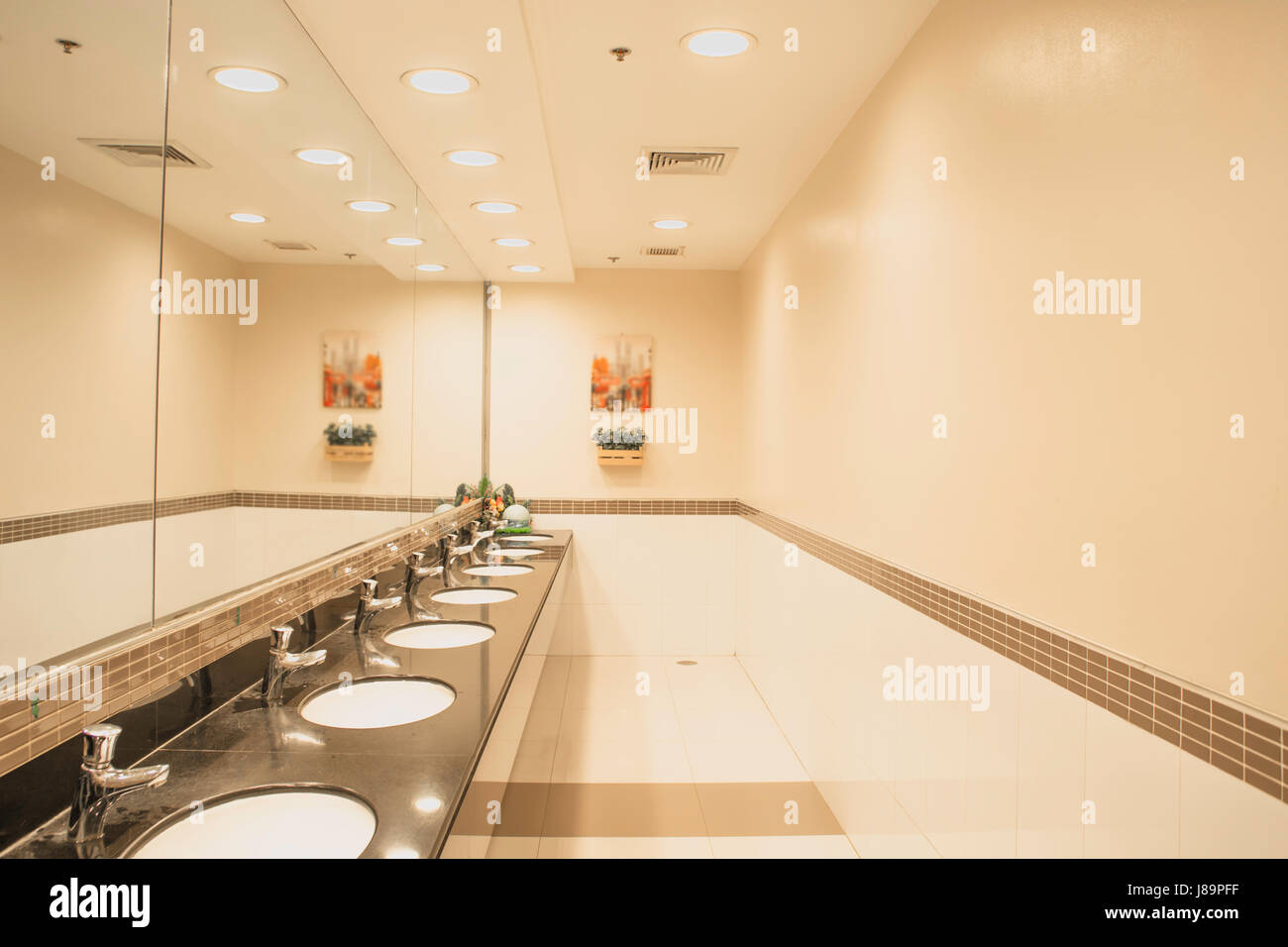 public empty restroom for washing hands sinks and mirrors Stock Photo ...