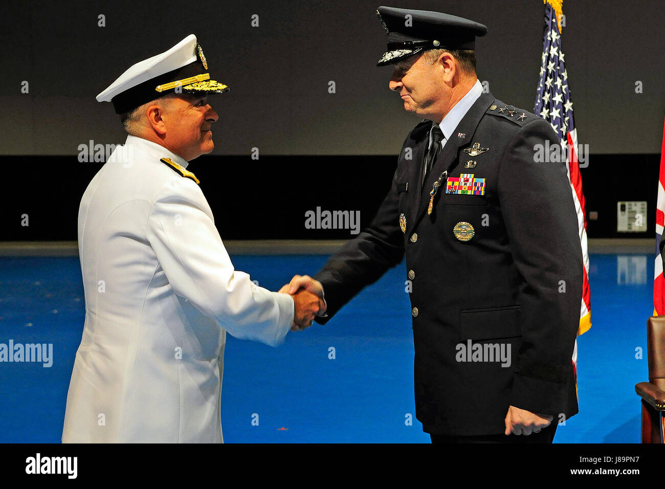 Lt. Gen. Chris Bogdan (right) shakes hands with Vice Adm. Mat Winter ...