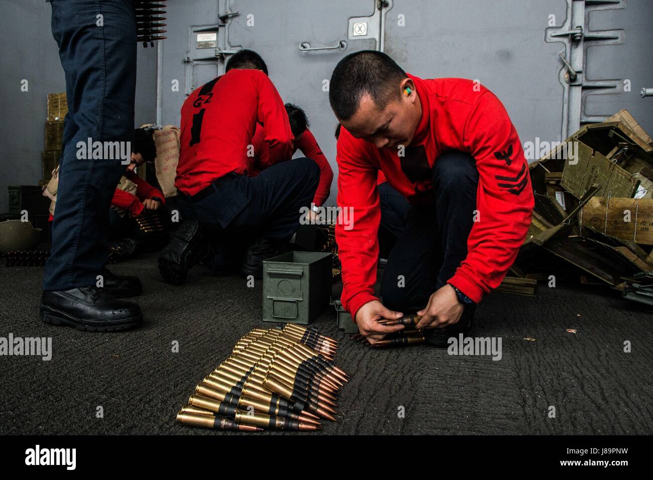 Sailors aboard the forward-deployed aircraft carrier USS Ronald Reagan ...