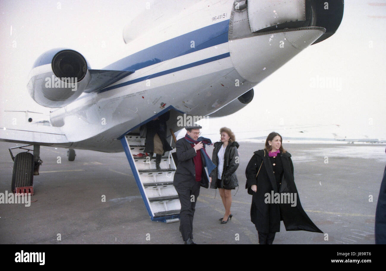 men and women exiting plane Stock Photo - Alamy