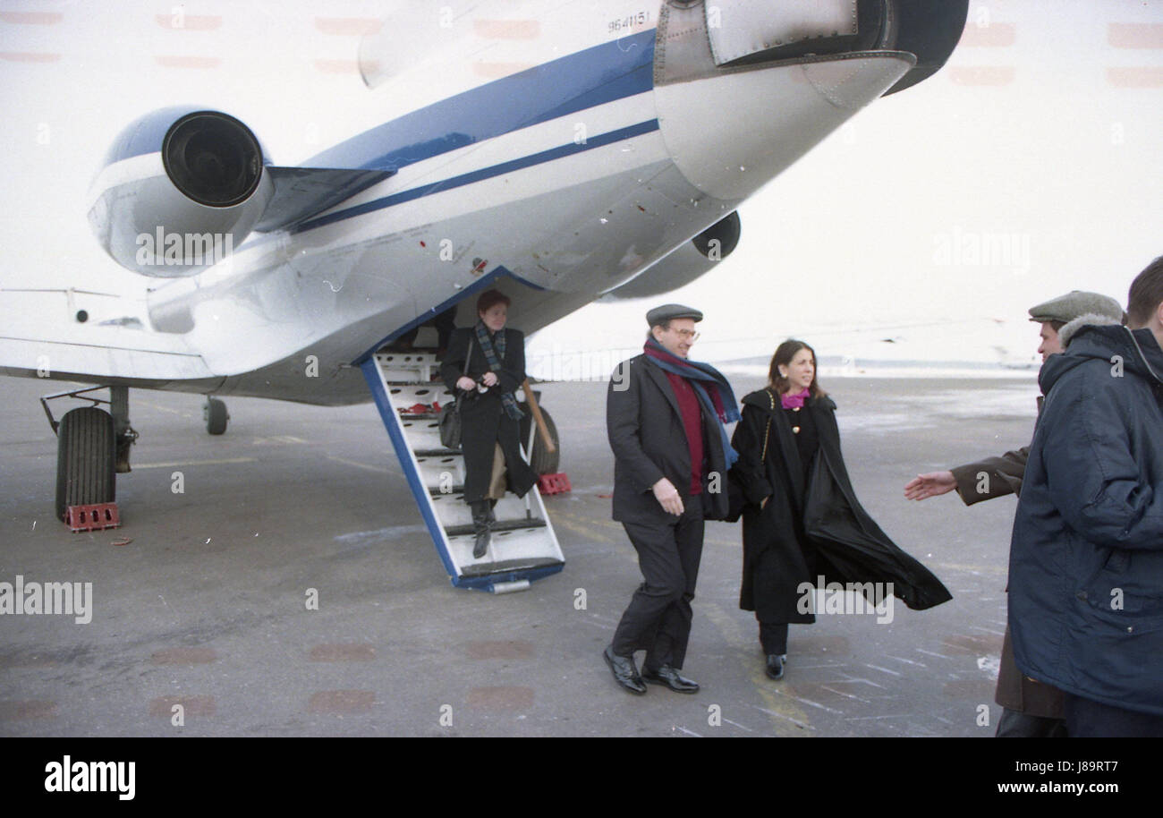 men and women exiting plane Stock Photo - Alamy