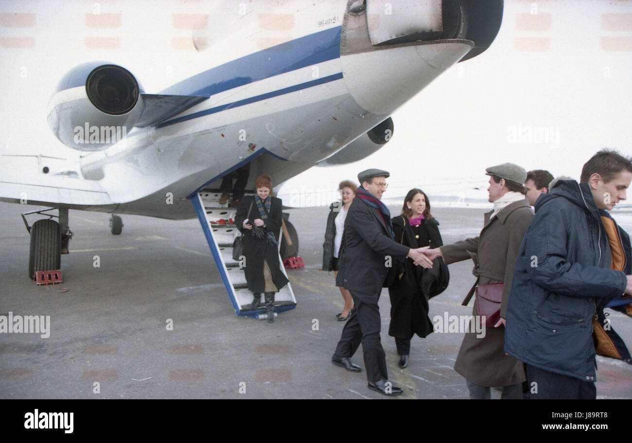 men and women exiting plane Stock Photo - Alamy
