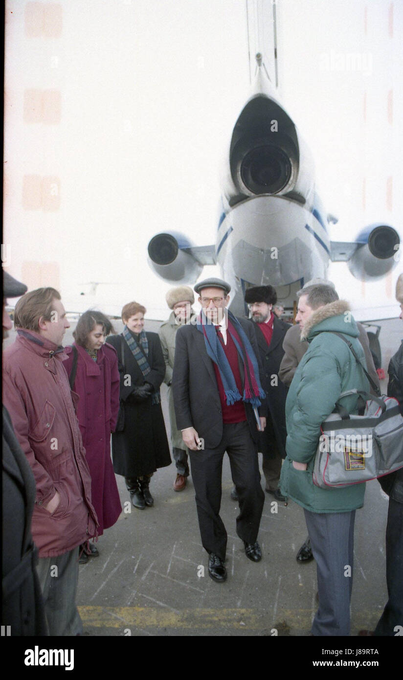 men and women exiting plane Stock Photo - Alamy