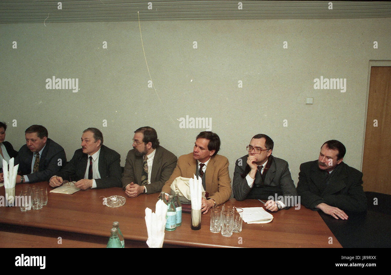group of men sitting Stock Photo - Alamy