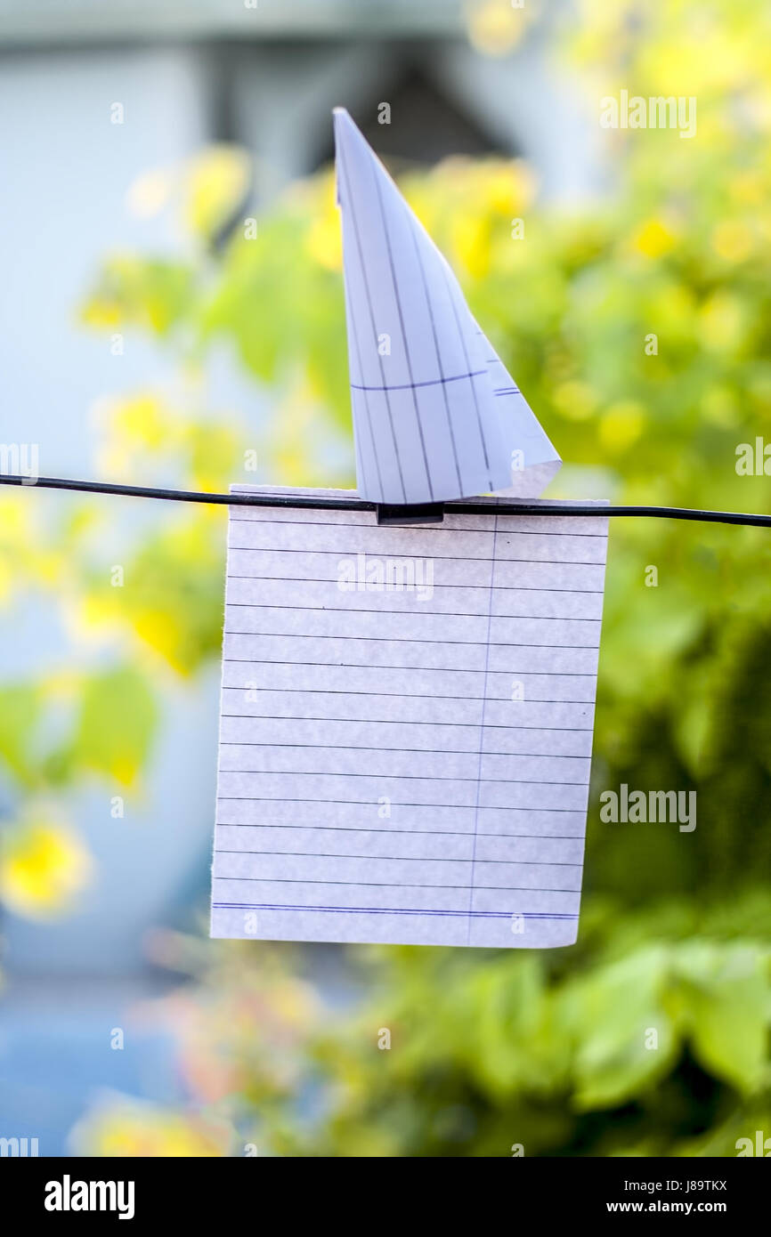 Note book paper hanging on the washing line Stock Photo - Alamy