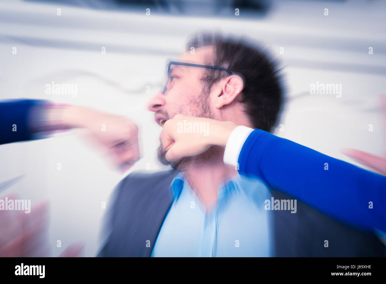 Businessman hit in the face by two female fists. Punching, smashing and ...