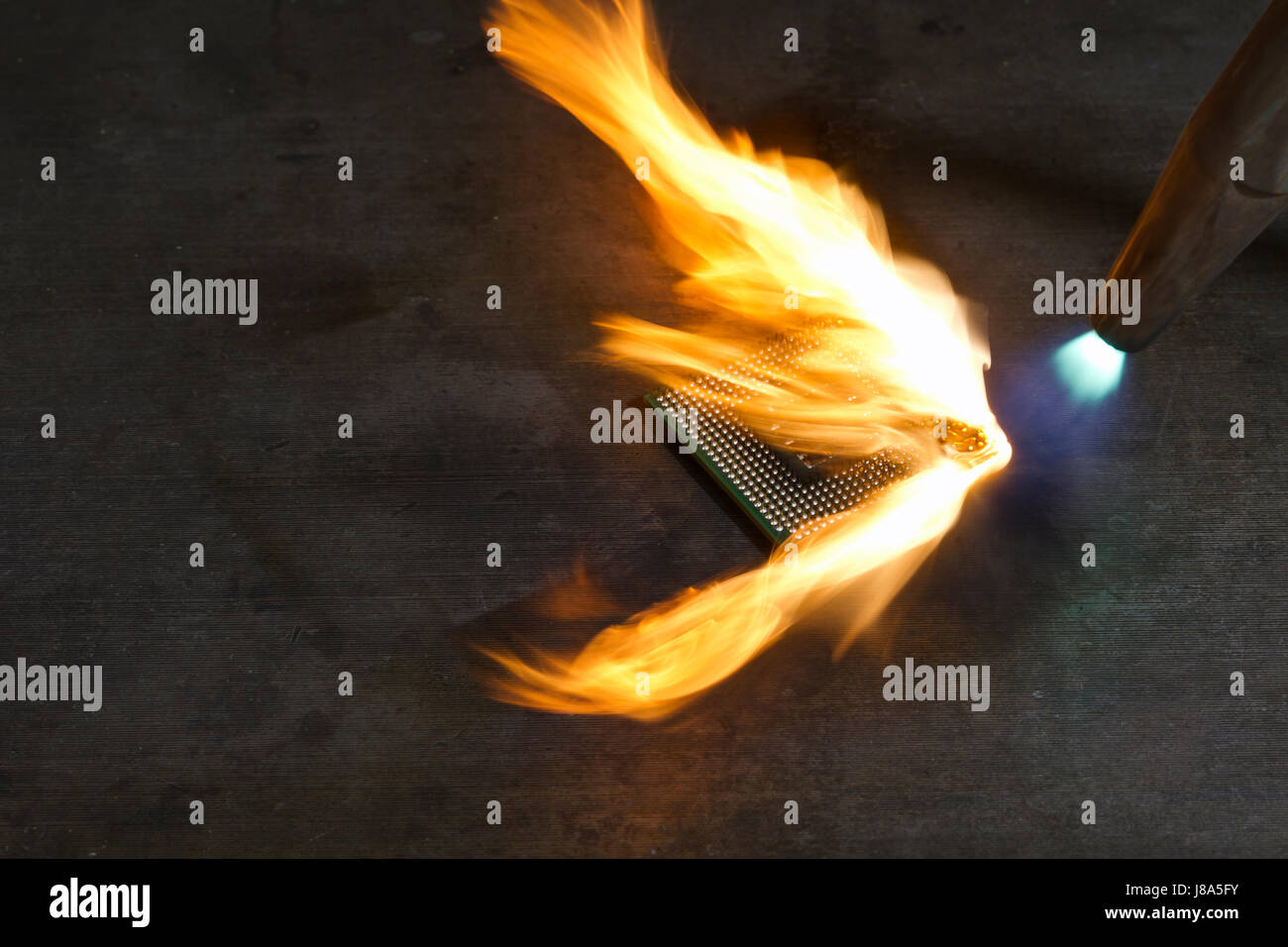 burning a computer chip with welding torch Stock Photo - Alamy