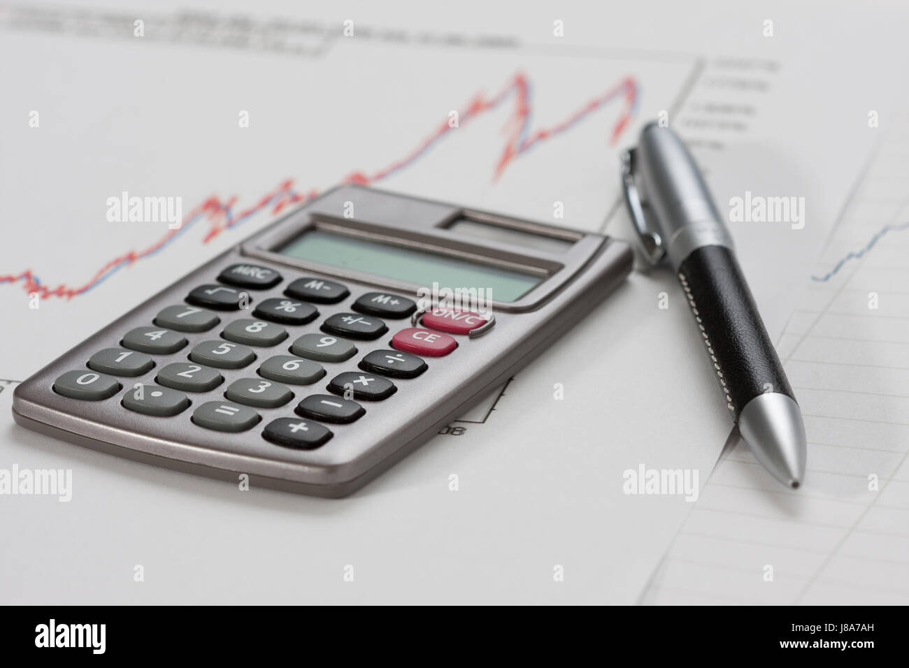 calculator,pen and diagram Stock Photo - Alamy