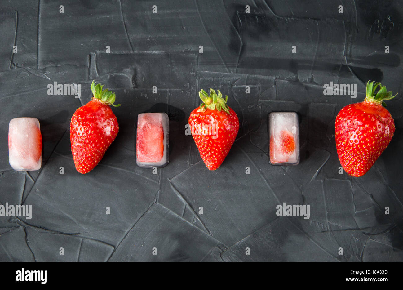 background with fresh strawberry and ice cubes with strawberries Stock ...