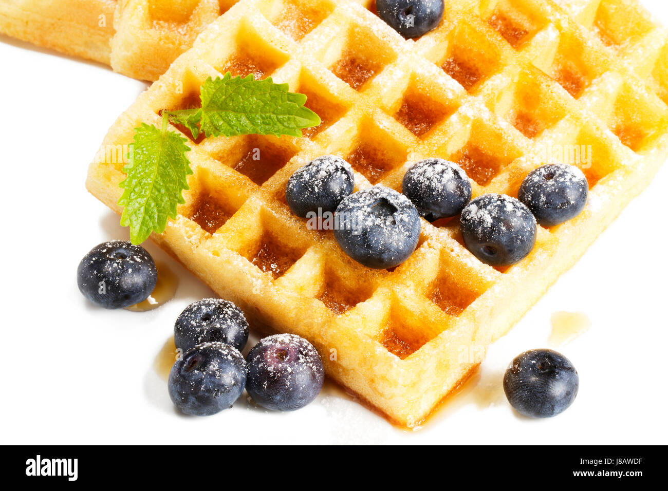 waffles with sugared blueberries and melissa syrup Stock Photo - Alamy