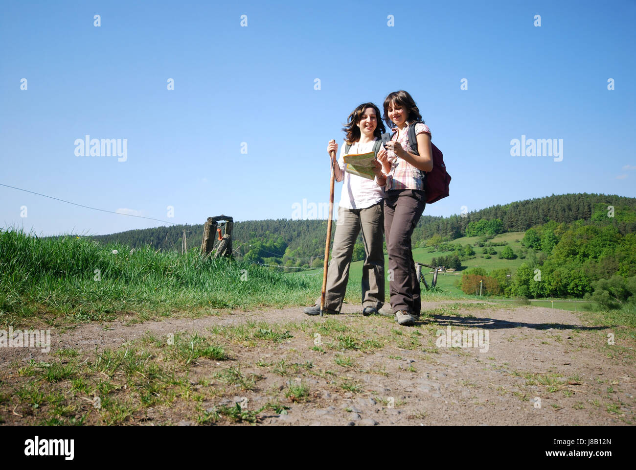 hikers with compass and map Stock Photo - Alamy