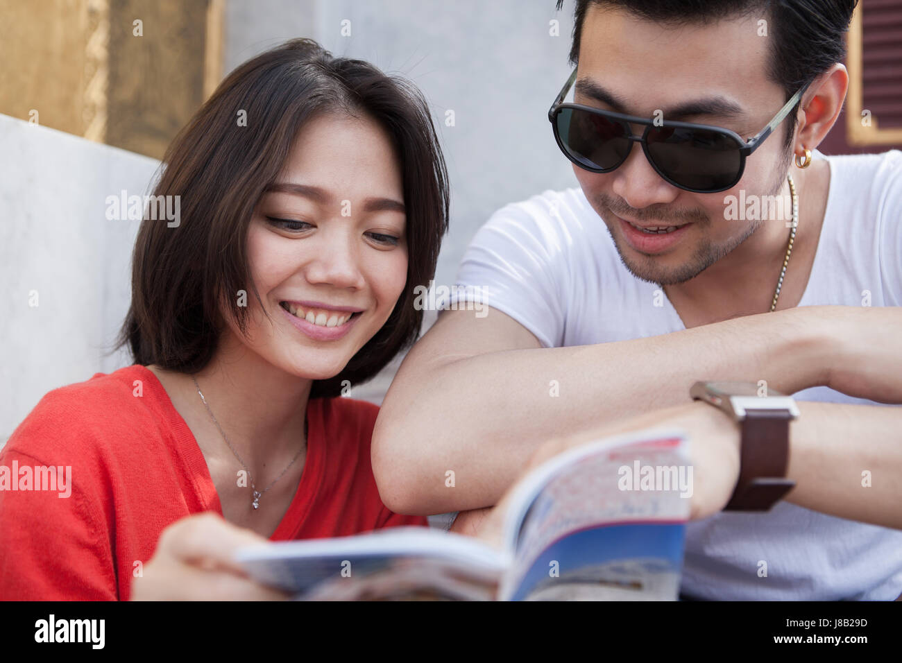 Reading a guide book hi-res stock photography and images - Alamy