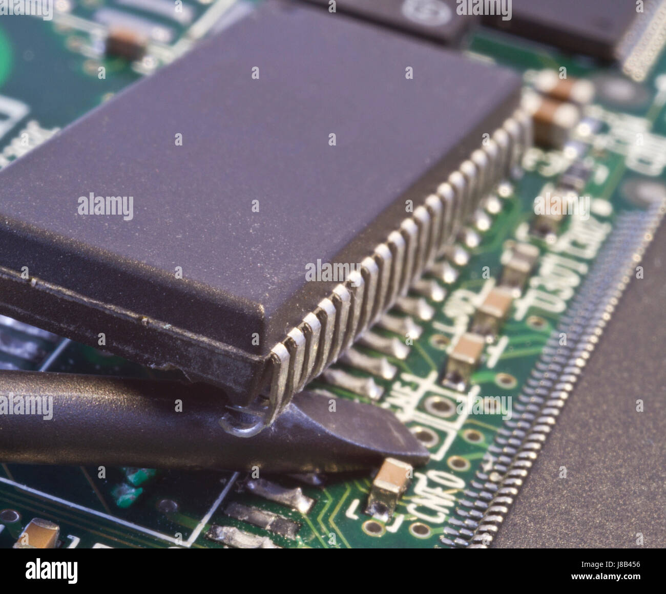 Taking chip from circuit hi-res stock photography and images - Alamy