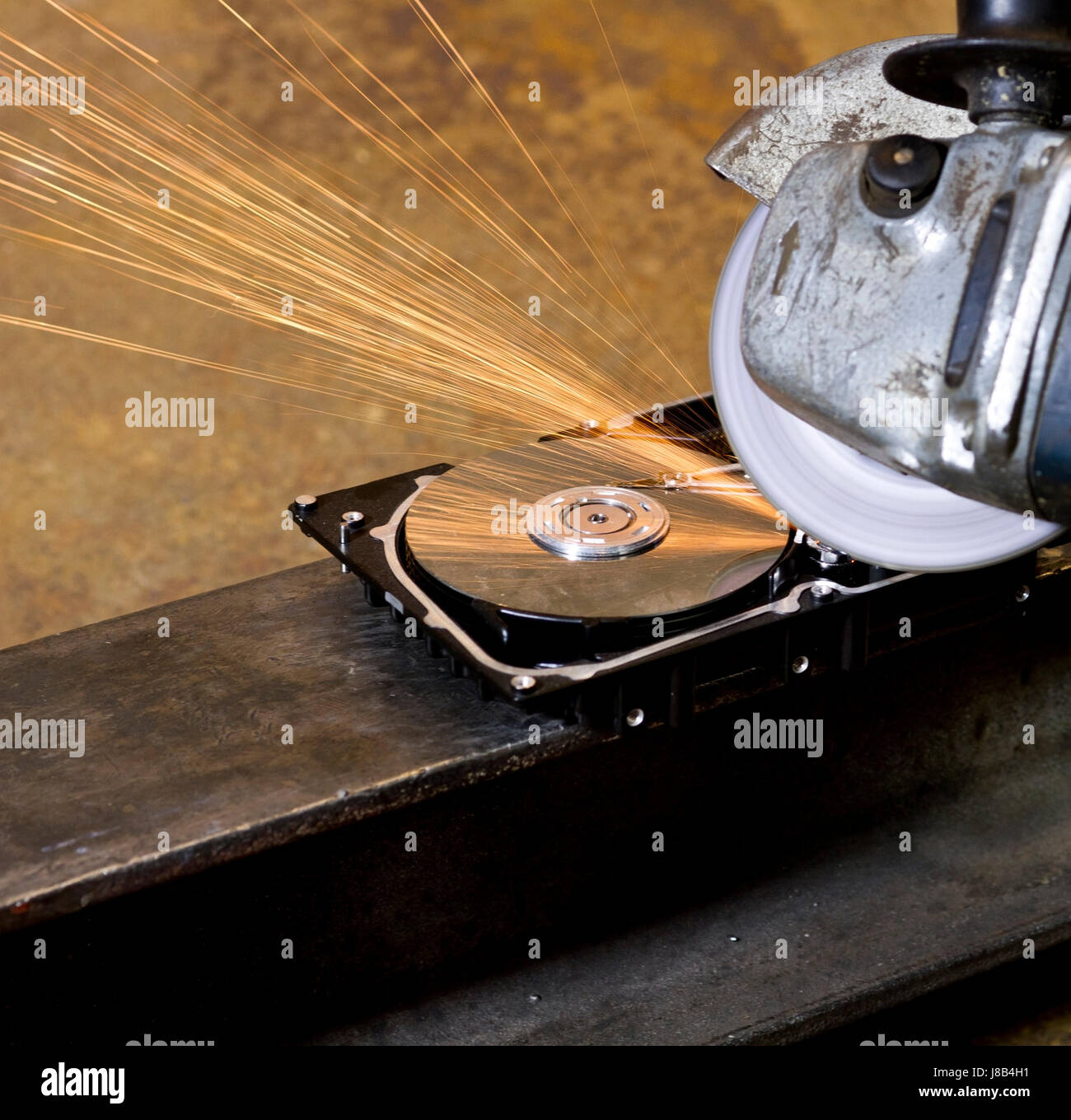 angular grinder cleaning data from hard drive Stock Photo - Alamy