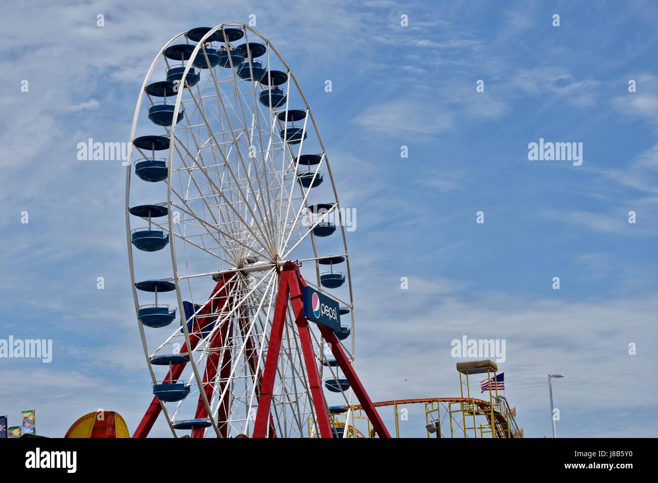Ferris wheel at theme park Stock Photo - Alamy