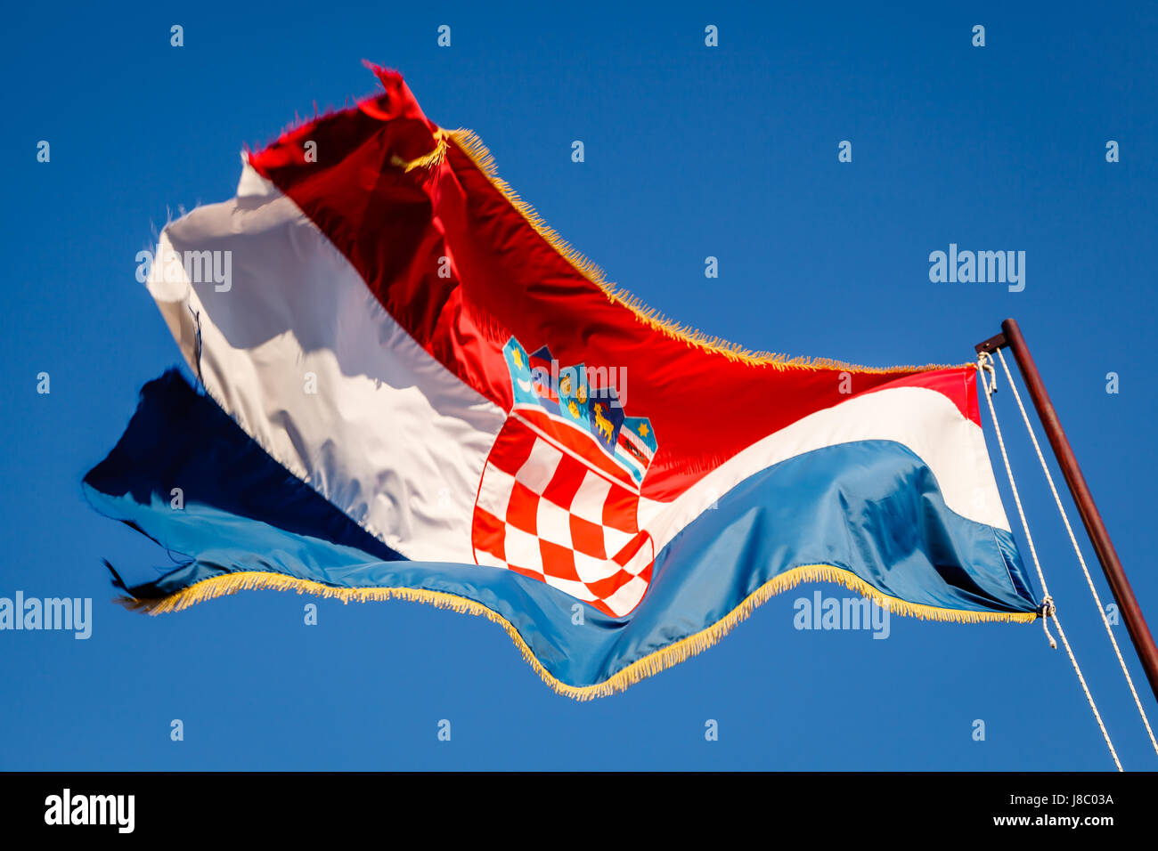 Croatian Flag Waving on a Pole over Beautiful Blue Sky in Omis, Croatia ...