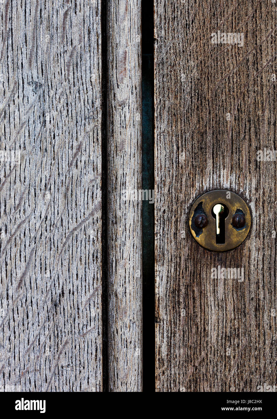 Old wooden door with metal lock close up texture background Stock Photo ...