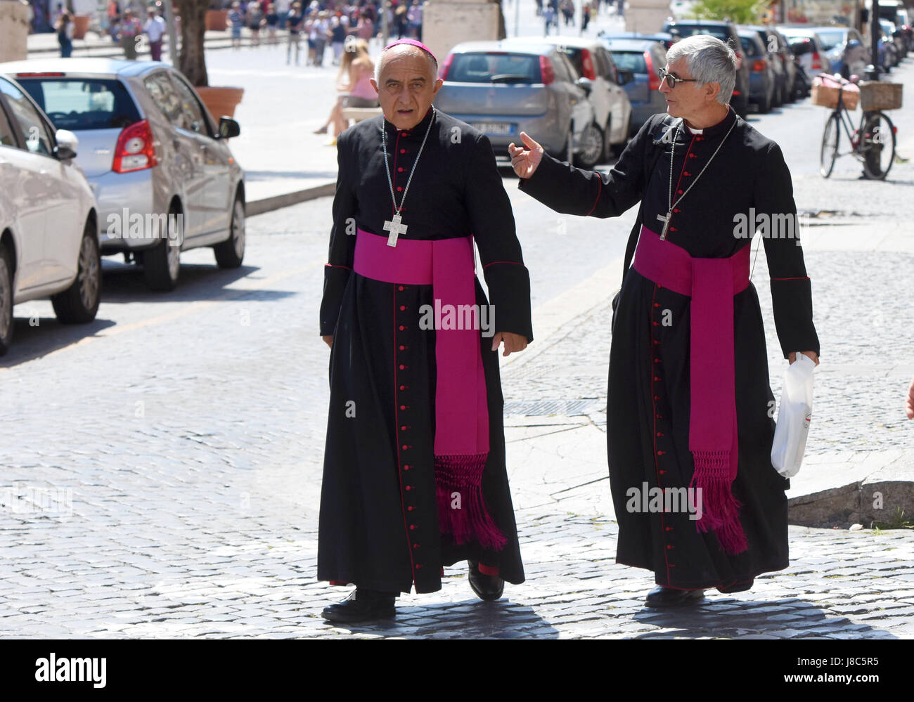 Two high ranking members of the Catholic Church walking around the ...