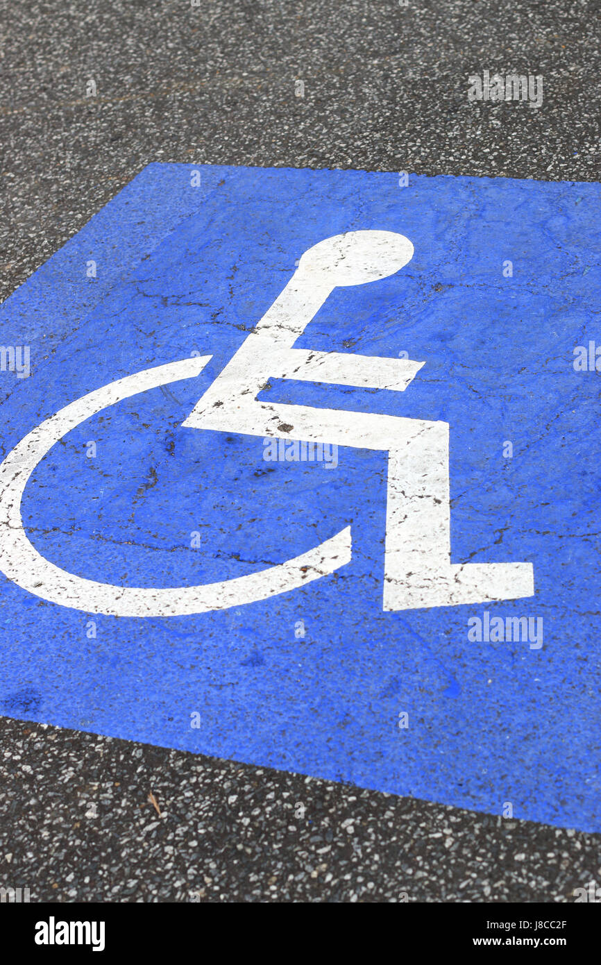 Painted Disable Parking sign on Asphalt Stock Photo - Alamy