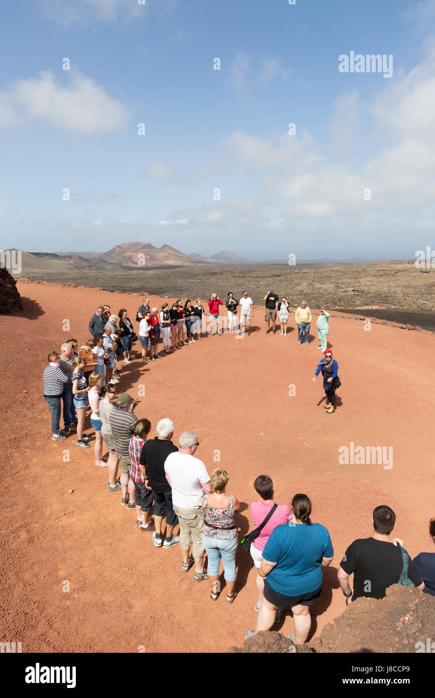 Tourists on a guided tour, Timanfaya National Park ( Parque Nacional de ...