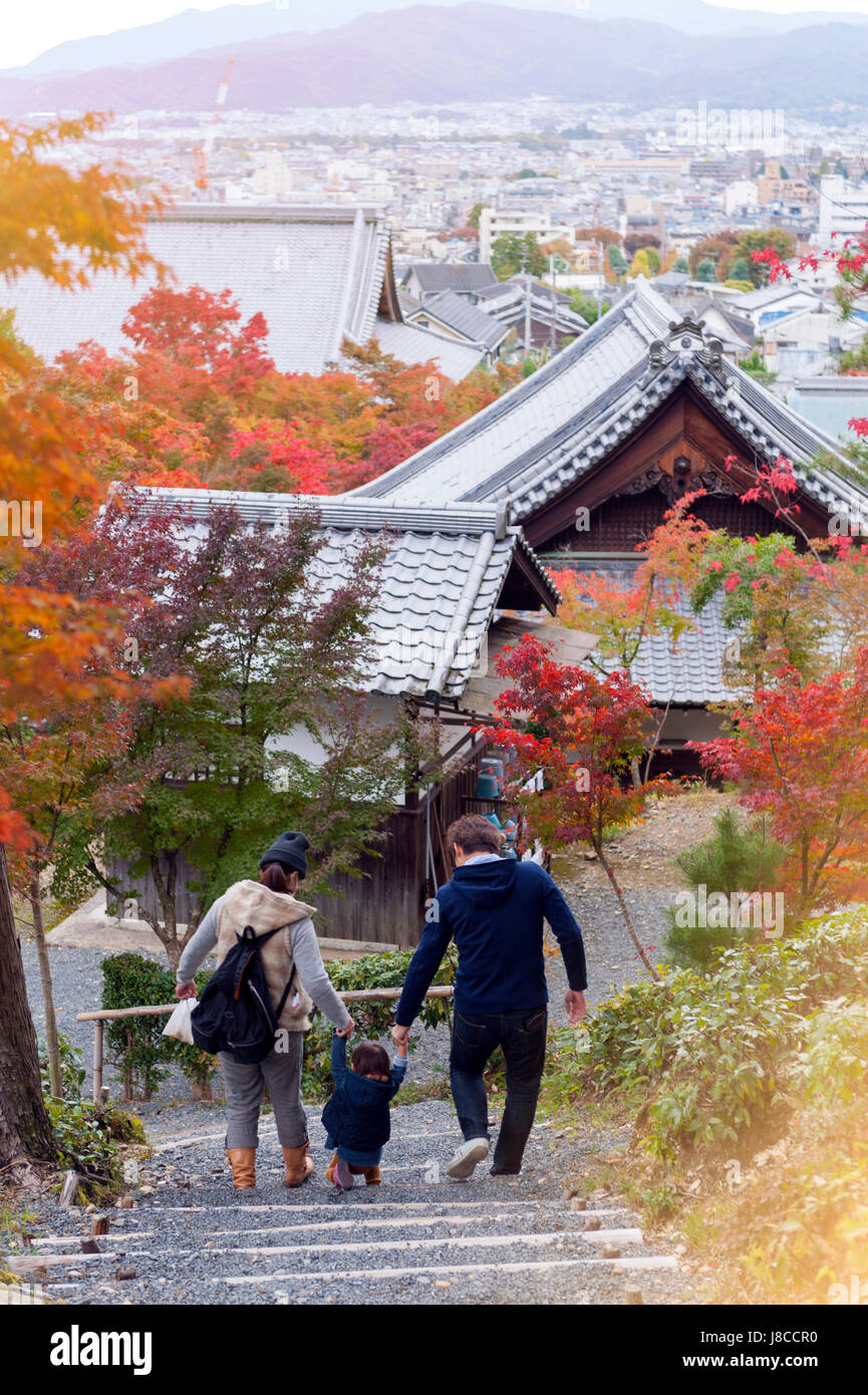 Happy japanese family in a city park hi-res stock photography and ...