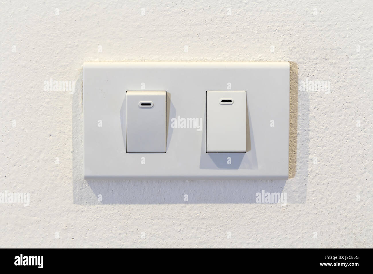 Light socket on white wall Stock Photo - Alamy