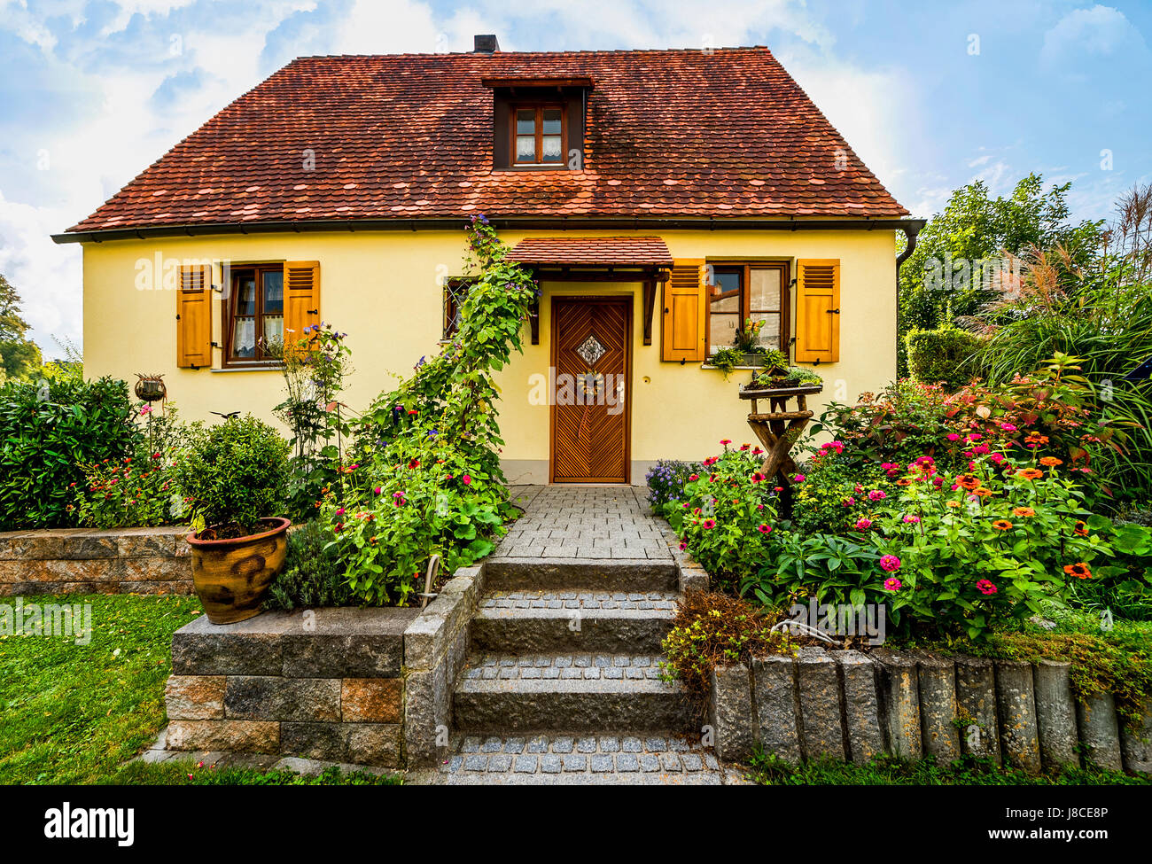 Picturesque house with an orchard in German countryside Stock Photo - Alamy
