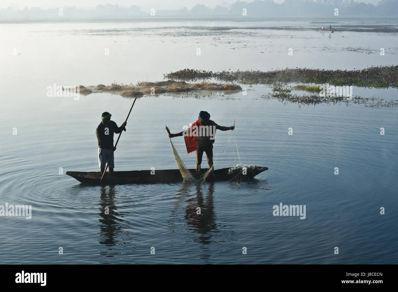 Fishermen on a lake ( India Stock Photo - Alamy