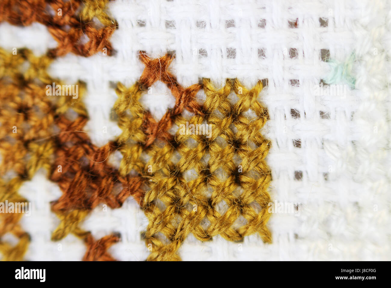 Macro shot fragment embroidery pattern brown thread handmade embroidery ...