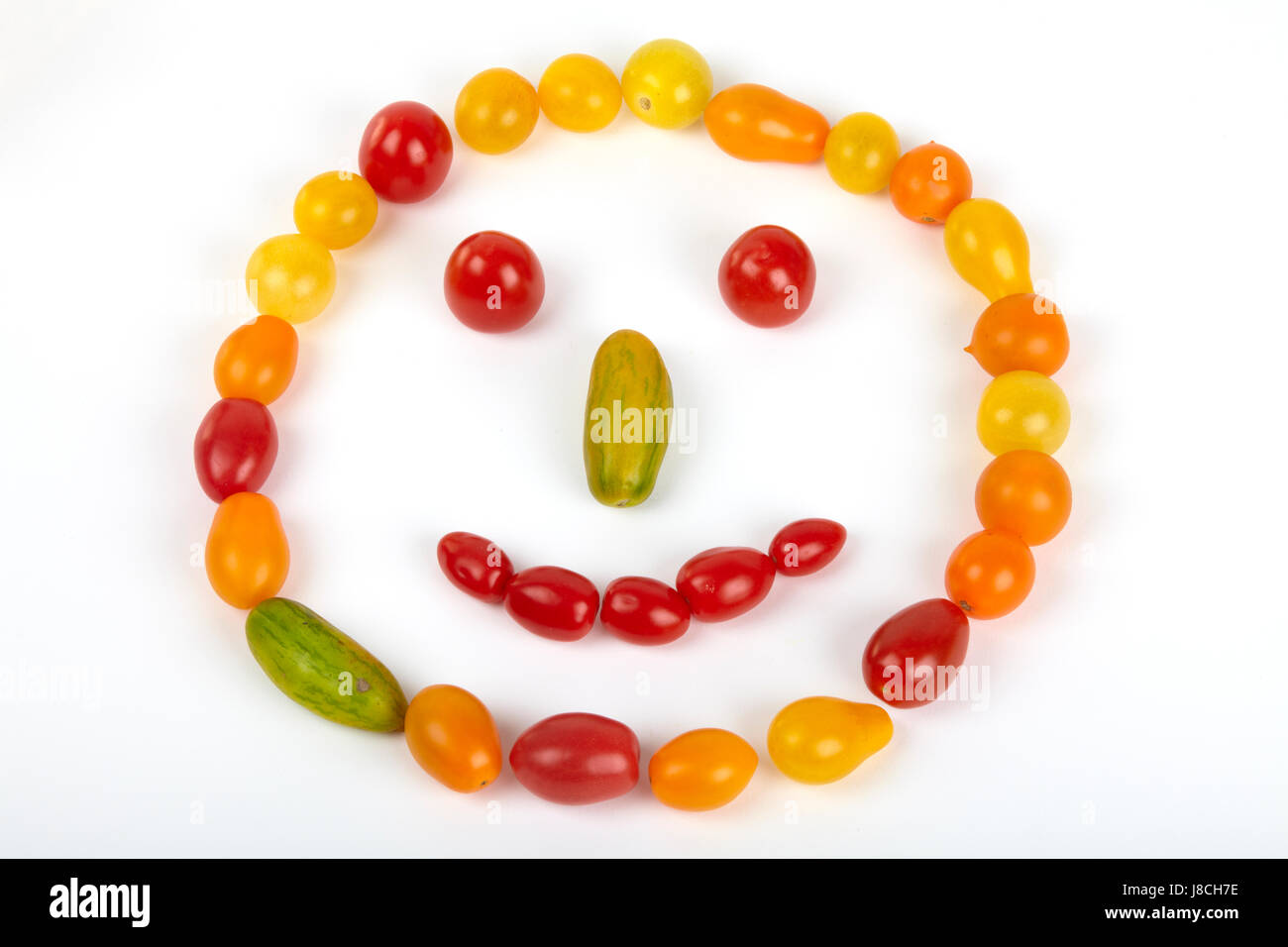 smiley face made of small organic tomatoes. smiley face made up of ...