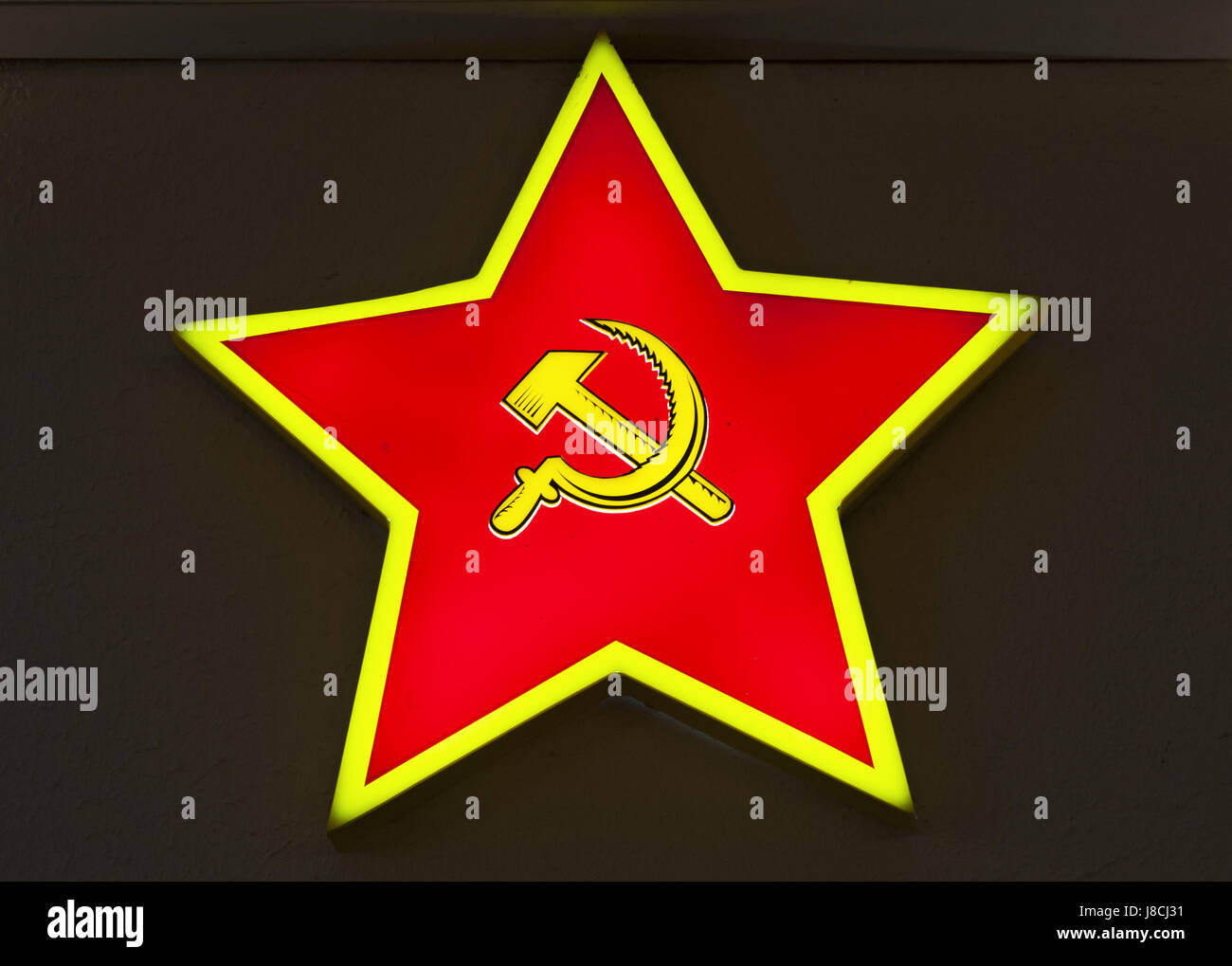 Moscow: a neon light in the shape of a star with the hammer and sickle ...