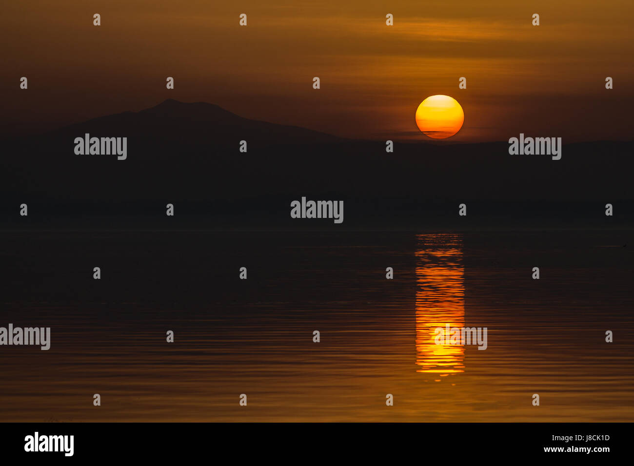Beautiful sunset clouds reflections on the water hi-res stock ...