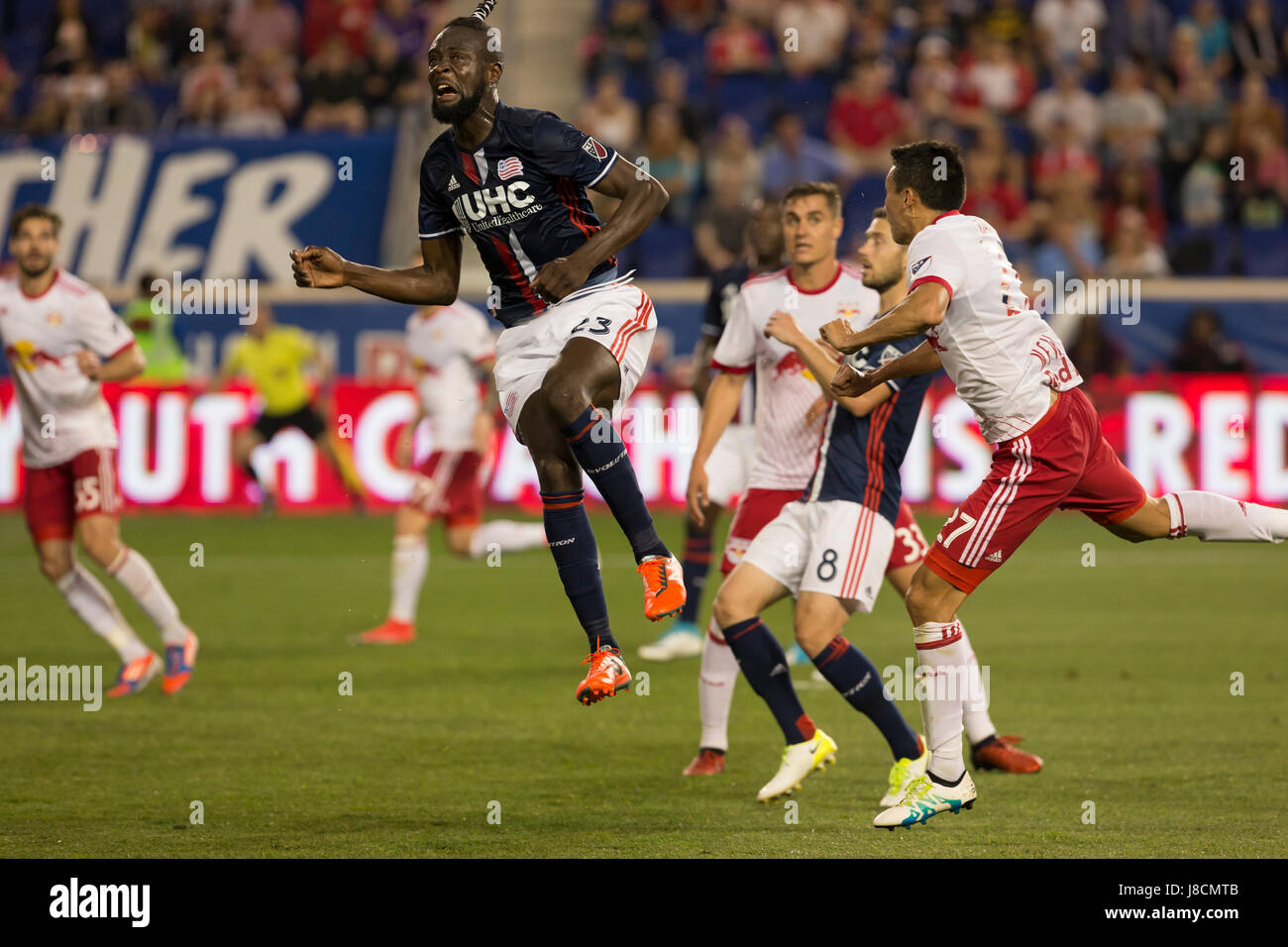 Kei Kamara (23) of New England Revolution fights for ball during MLS ...