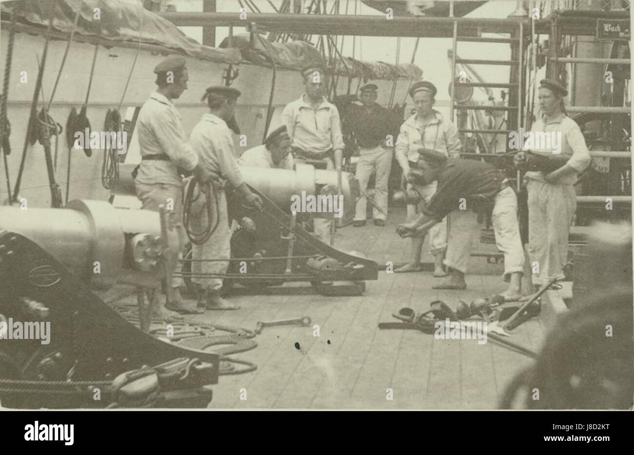 Loading gun on the Nymphe is a depiction of a naval scene from 1872, showing the crew of the ...