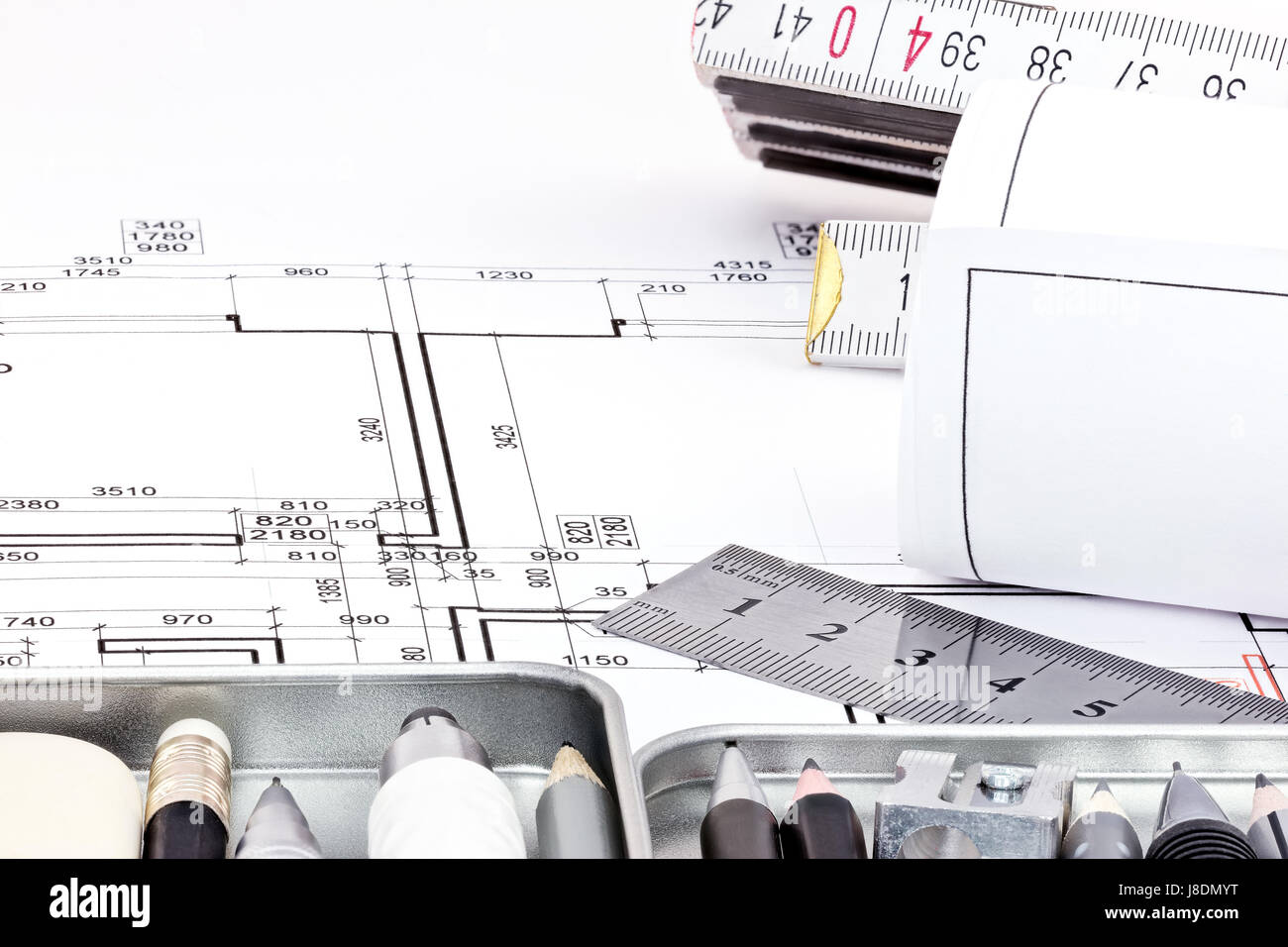 rolls of architectural blueprint with designers drawing tools Stock ...