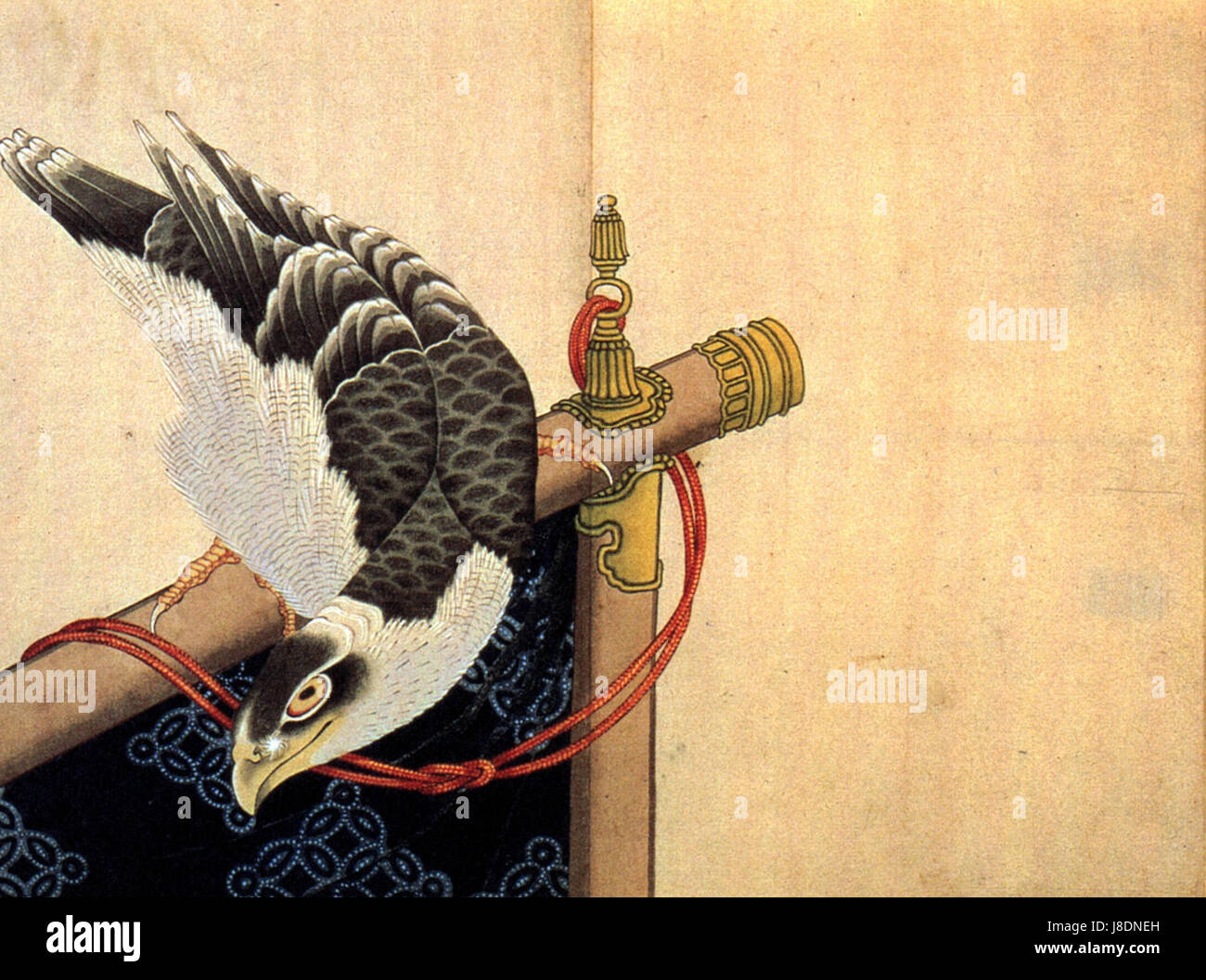 The image features a hawk positioned on a ceremonial stand, often seen ...