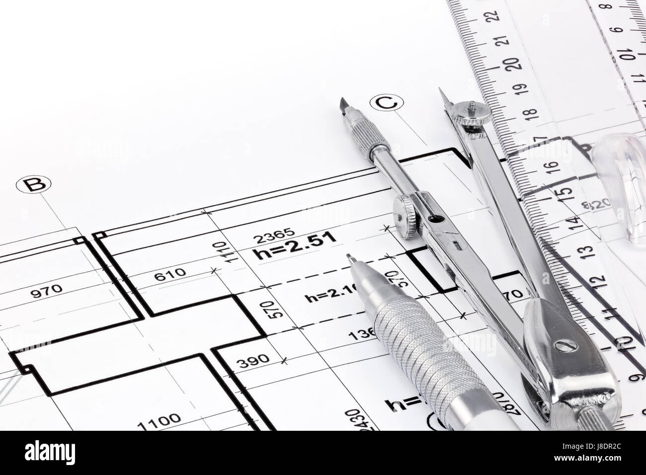 ruler, pen and drawing compass on architectural drawing of modern house ...