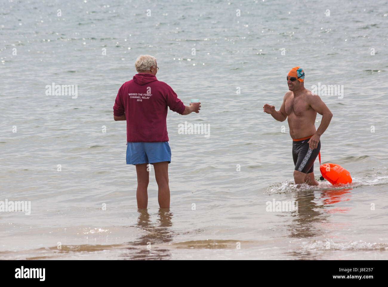 Swimmer walking out of the water hi-res stock photography and images ...