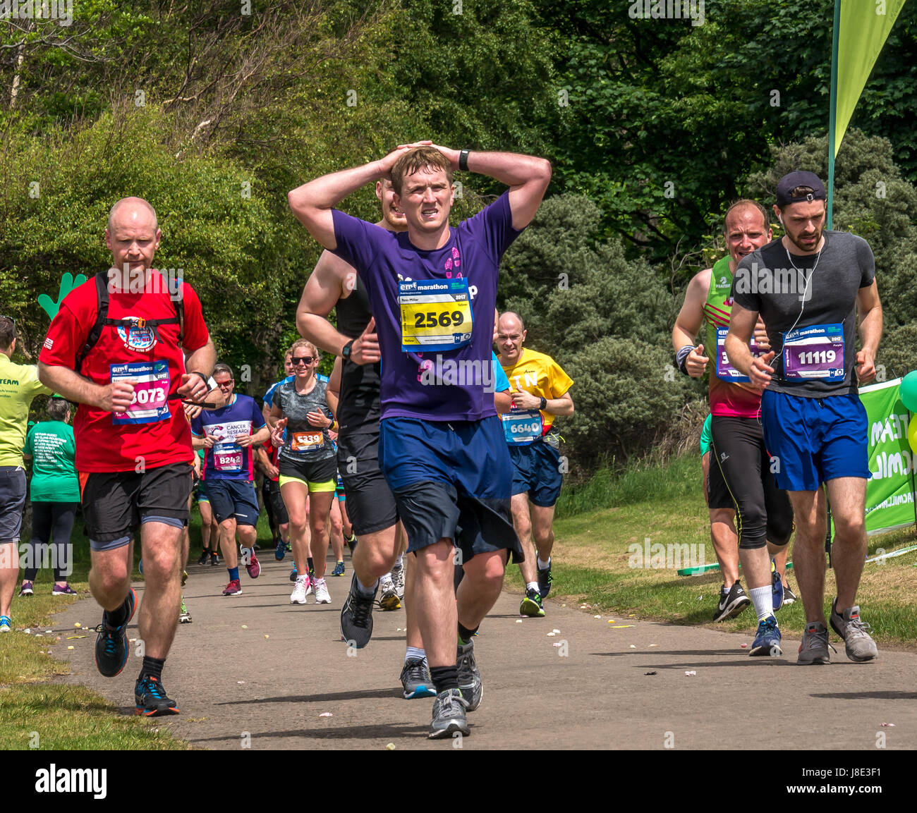Exhausted male runner head in hands hi-res stock photography and images ...