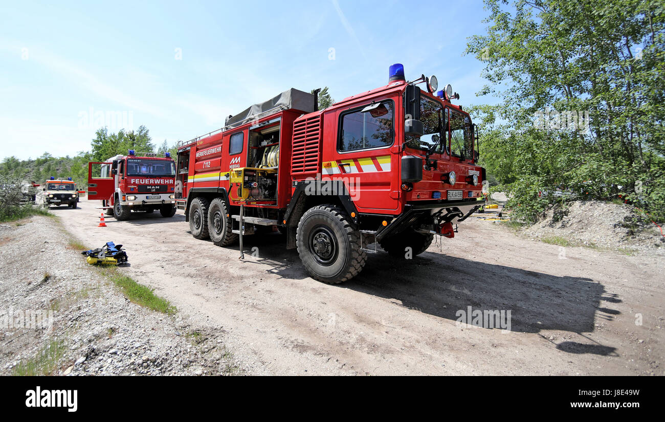 Emergency vehicles of the Mibrag works fire brigade park during a ...