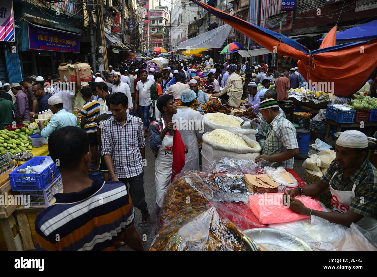 Vendor sells foods in the traditional Ifter market at Chalk Bazar as the first day of the Holy ...