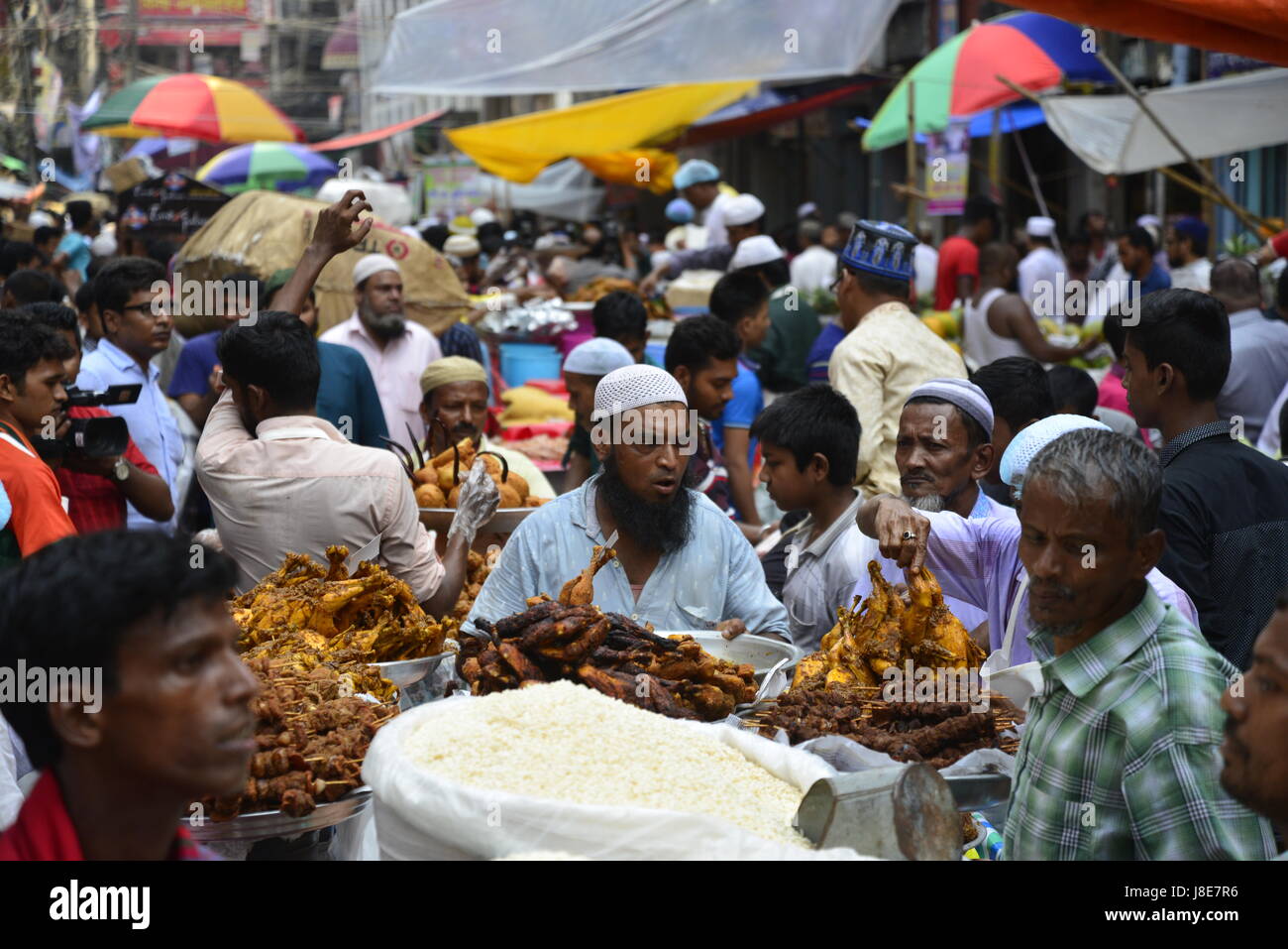 Vendor sells foods in the traditional Ifter market at Chalk Bazar as the first day of the Holy ...