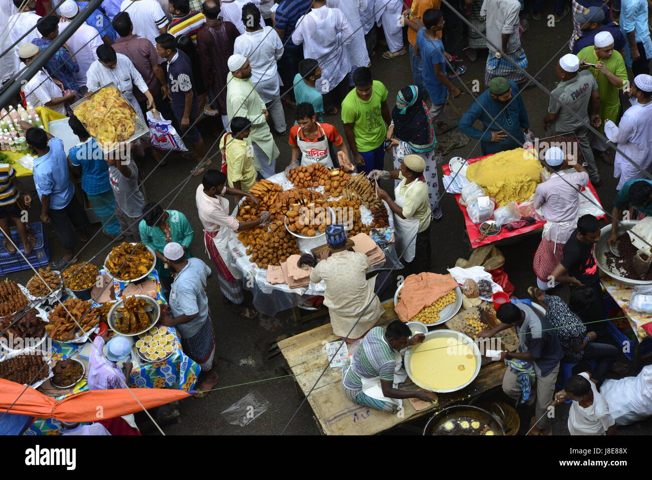 Vendor sells foods in the traditional Ifter market at Chalk Bazar as the first day of the Holy ...
